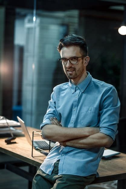 Premium Photo Young Man In Glasses In Office