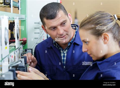 Female And Male Technician Repairing System Stock Photo Alamy