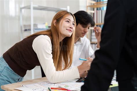 Design Collaboration And Creativity Designers Interact While Reviewing Ui Sketches And Color