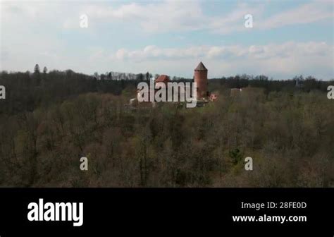 Medieval Style Red Brick Castle With A Cylindrical Tower Pitched Roof
