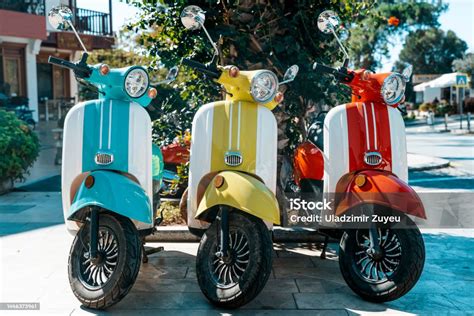 Scooter Motorcycle On City Street Vintage Classic Retro Scooters Various Bright Colors On A