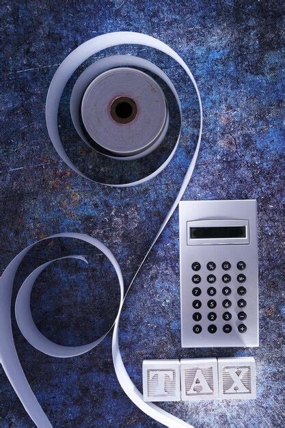 Premium Photo Directly Above Roll Of Adding Machine Tape Calculator And Wood Block With Single