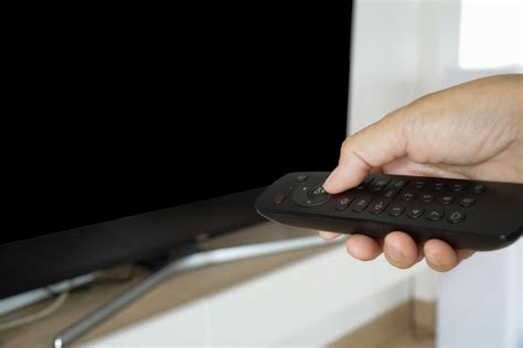Premium Photo Asian Old Woman Presses The Remote