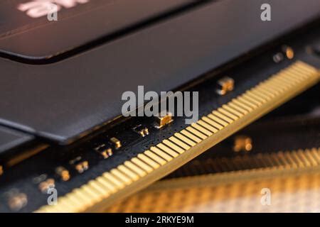 Memory Module DDR DRAM With Electrical Contacts In Blue Light Computer RAM Chipset Close Up