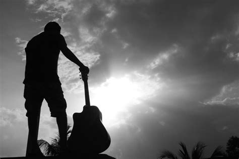Premium Photo Silhouette Man Standing Against Sky With Guitar