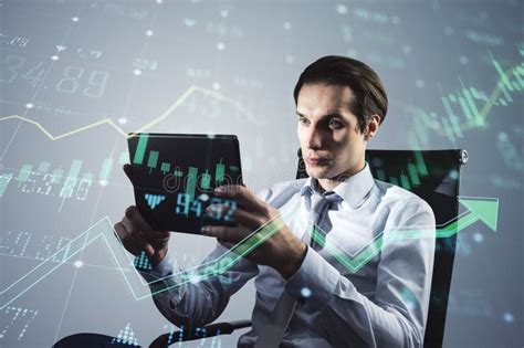 A Professional Man Analyzing Financial Data On A Tablet With Virtual