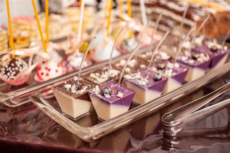 Delightful Assortment Of Colorful Dessert Jellies Elegantly Presented On A Buffet Table Stock