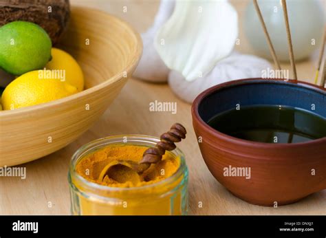 A Table Top Arrangement Of Spice Oil And Massaging Tools Used In
