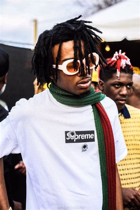 Download Playboi Carti Styling In His Supreme Shirt Wallpaper