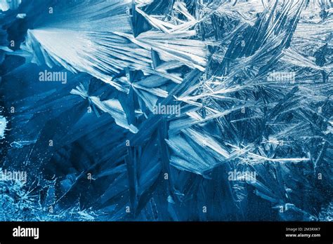 Christmas Background With Frozen Pattern On Window Glass Real Blue Texture Of Winter Snowfrost