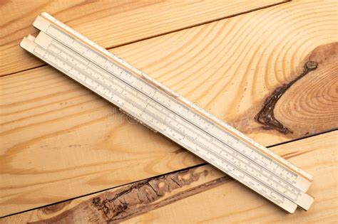 slide rule on a wooden table top view macro stock image image of