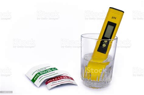 Ph Meter Measuring The Ph Of The Water In The Glass On Isolated White ...