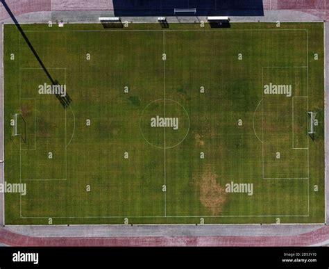 Overhead View Of A Full Size Football Field In Bad Shape With Patchy