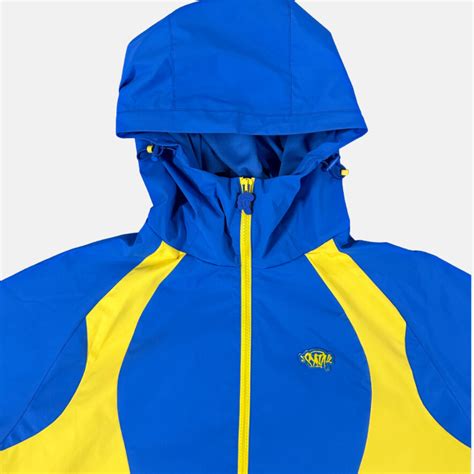 Syna Logo Vortex Woven Jacket Blueyelllow No Sauce The Plug