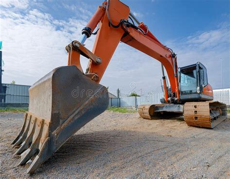 Backhoe Bucket Large Orange Backhoe Parked At A Construction Site Stock Illustration