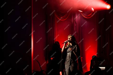 Premium Photo Singer With Her Band Performing On Stage Concert View