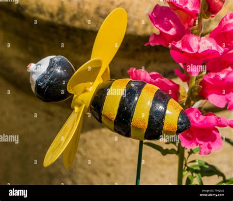 Bumble Bee Garden Ornament With Black And Yellow Stripes Which
