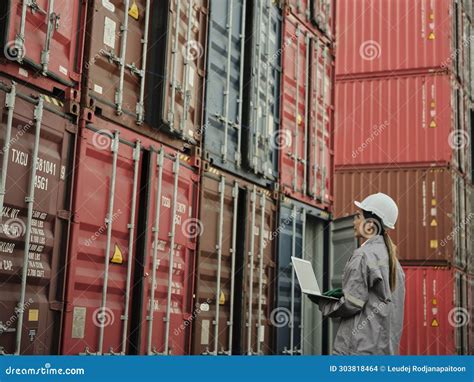 Female Worker Wearing Safety Helmet And Working With Container Stock