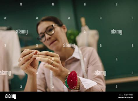 Woman Needle Threading Studio Hi Res Stock Photography And Images Alamy