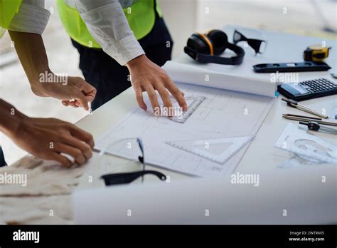 Team Engineer Foreman Architect Meeting For Colleagues Discussing And Checks Construction