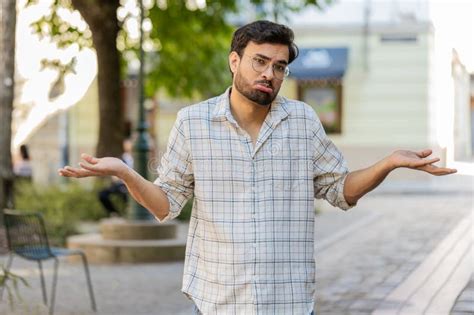 Confused Indian Man Feeling Embarrassed About Ambiguous Question Having Doubts On City Street