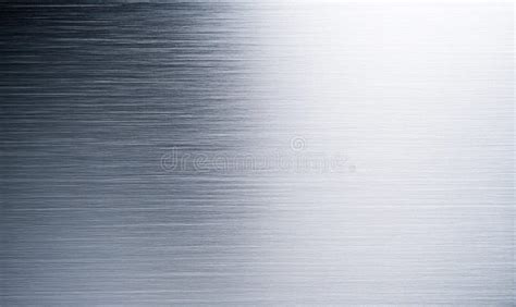 Close Up Of A Brushed Metal Surface With A Subtle Gradient Of Light Creating A Sleek Texture