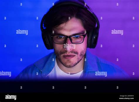 Programmer In Headphones Coding Working On Computer Stock Photo Alamy