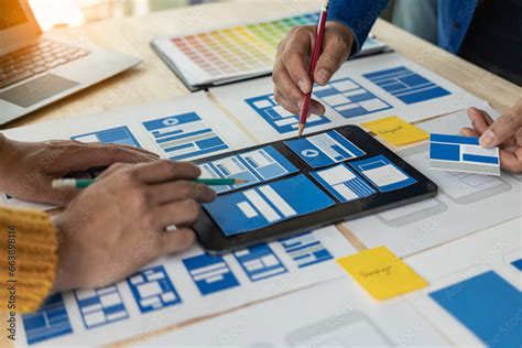 A Team Of Web Designers With The Ux Ui System Are Writing Programs And Layers To Customize The