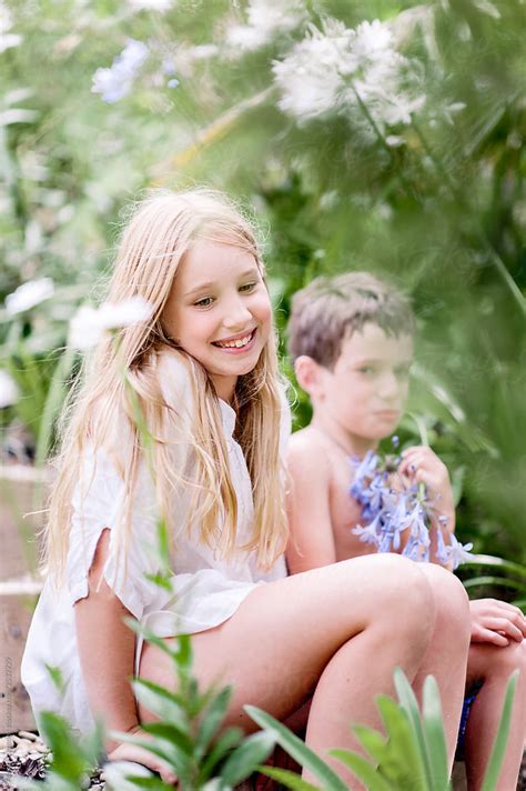 Smiling Pre Teenage Girl And Her Younger Brother By Stocksy Contributor Angela Lumsden Stocksy