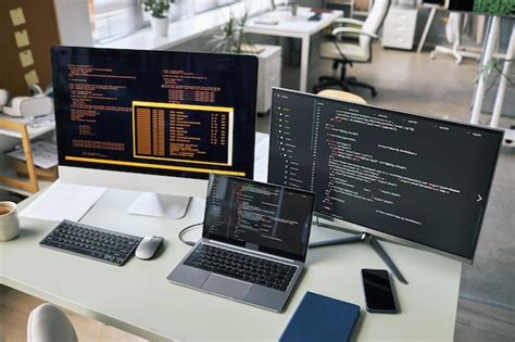 Premium Photo Computers And Laptop On Office Desk Of Software Developer