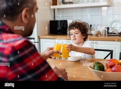 Father son clinking juice hi-res stock photography and images - Alamy