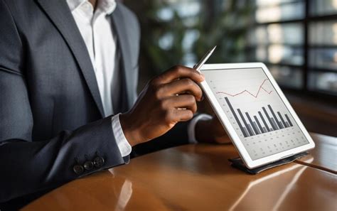 Premium Ai Image Businessman Using Tablet And Laptop Analyzing Sales