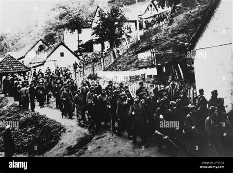 A Column Of German Prisoners Of War Being Marched Away To Internment