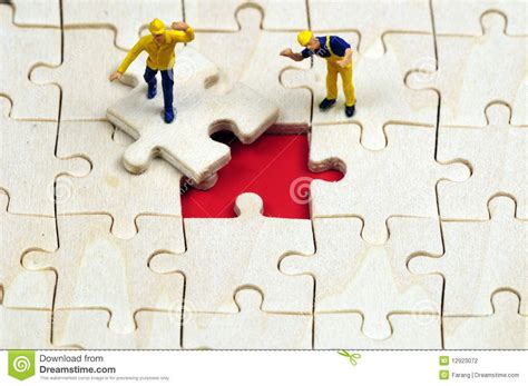 Solving A Business Puzzle Two Men Trying To Solve A Business Puzzle Sponsored Advertisement
