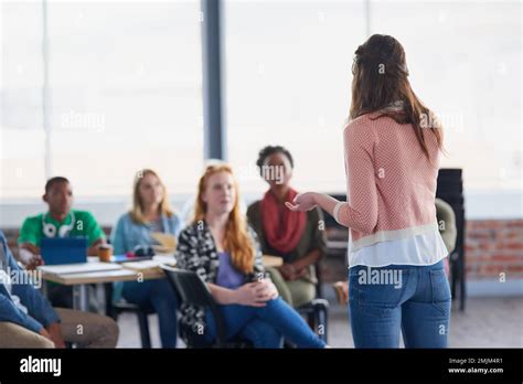 Giving Out Group Tasks Rearview Shot Of Young University Student