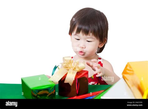 Cute Little Asian Girl Interesting Wrap A Beautiful T Box On Table