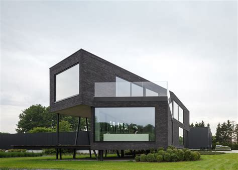 Brick Office Building By Wil Ma And Wastiau Raised On Angled Stilts