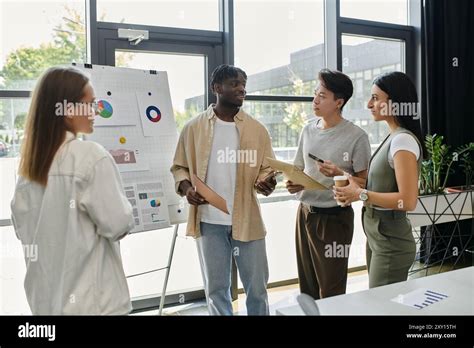 a group of colleagues huddle around a whiteboard analyzing charts and discussing strategies