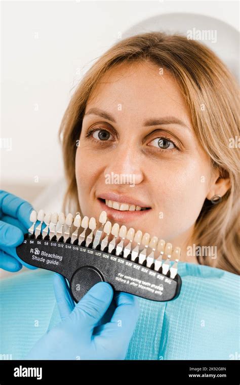 Teeth Color Shades Guide With Woman Patient Tooth Whitening Dentist