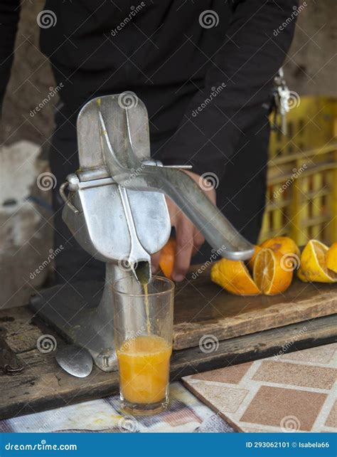 Hand of Men is Squeezing Orange Fruit Using Manual Hand Press Juicer Stock Image - Image of ...