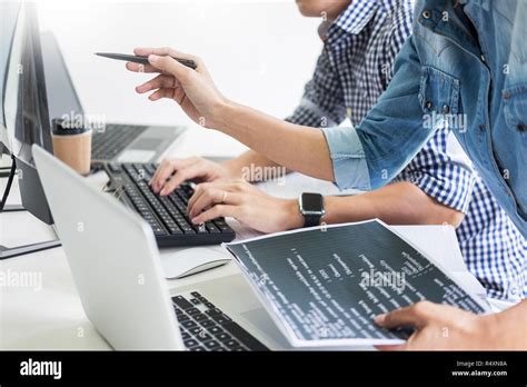 Asian Team Outsource Developer Looking Screen Programming Code Working