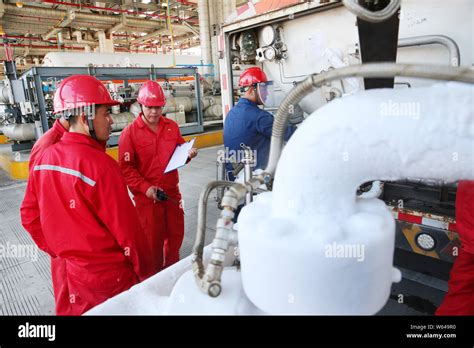 Chinese Workers Load A Tanker With Liquefied Natural Gas LNG At The Rudong LNG Terminal Of