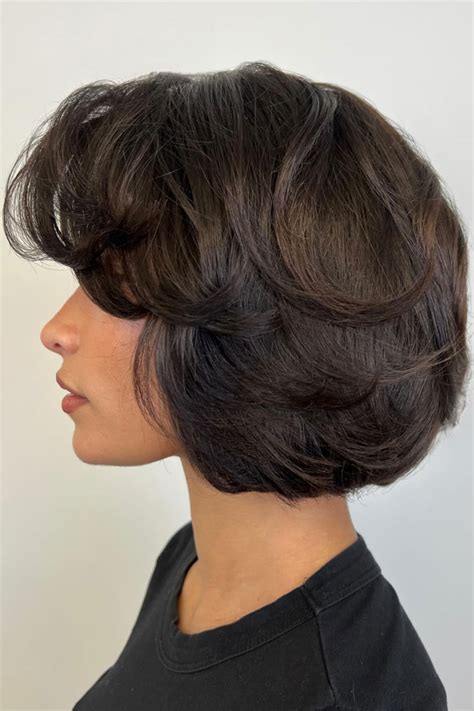 Voluminous Layered Bob With Feathered Ends And Bangs Voluminous Layered Bob With Feathered Ends And Bangs
