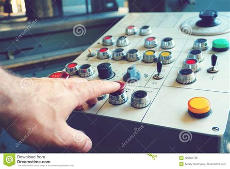 The Worker Uses The Control Panel Of The CNC Machine To Process The Material Stock Photo