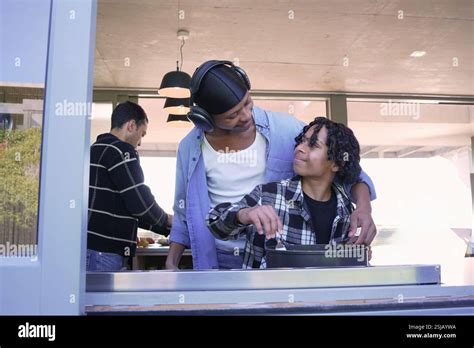 Brothers Cooking Together Stock Photo Alamy