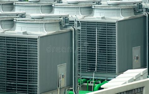 A View Of Multiple Large Air Conditioning Units Mounted On The Exterior Of A Grand Building