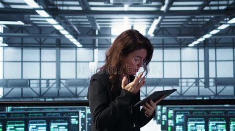 Server Room Admin Receiving Threat Detection Alert On Device Stock