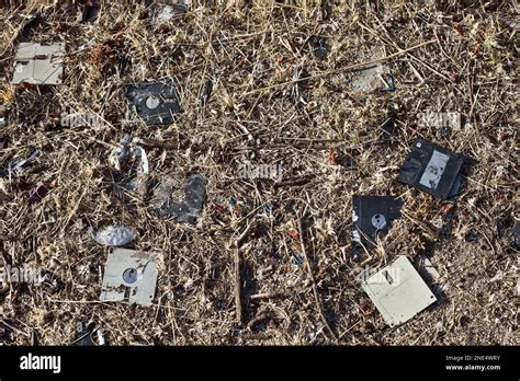Old Floppy Disks Thrown Away In A Field Where They Are Already Being