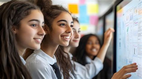 Teen Girls Engaged Collaborative Learning Interactive Education Technology Classroom Premium