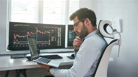 Busy Day Professional Male Trader Wearing Eyeglasses Analyzing